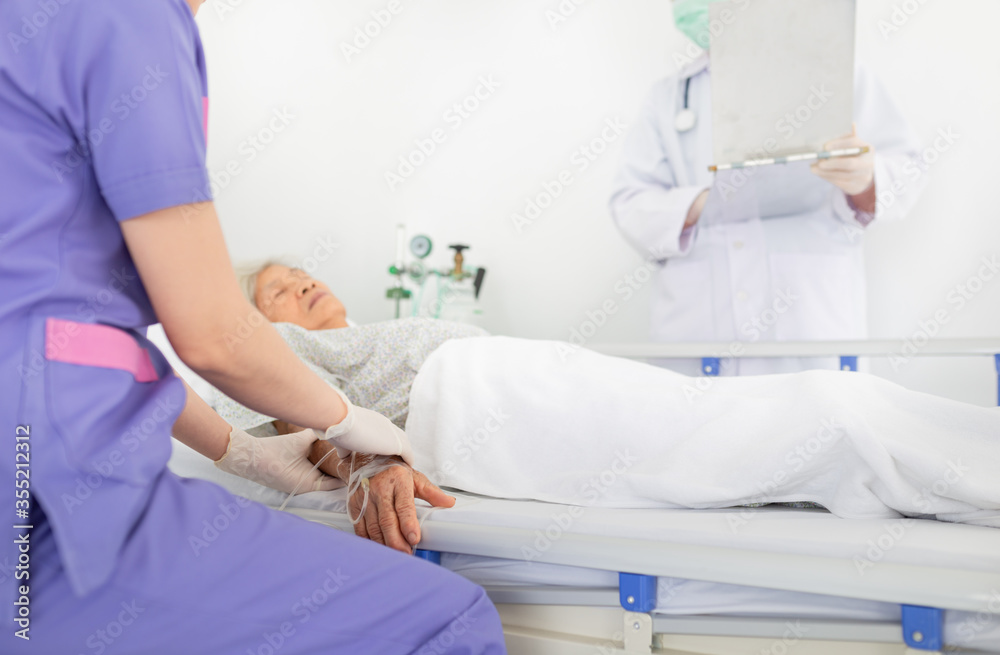 nurse use hand screening vital sign of old asian patient , doctor and ...