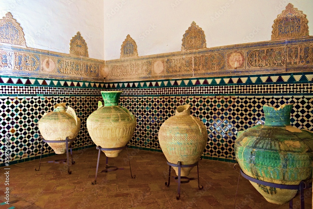 hall with ancient jars inside the Royal Palace of the Alcazar of ...