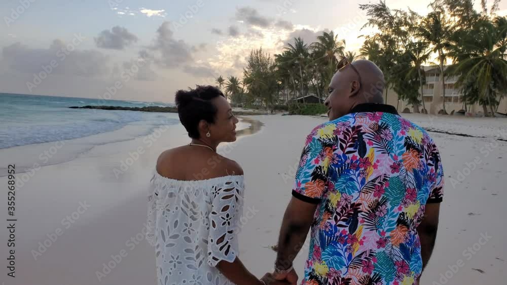 Black African American Married Couple on romantic walk on tropical ...