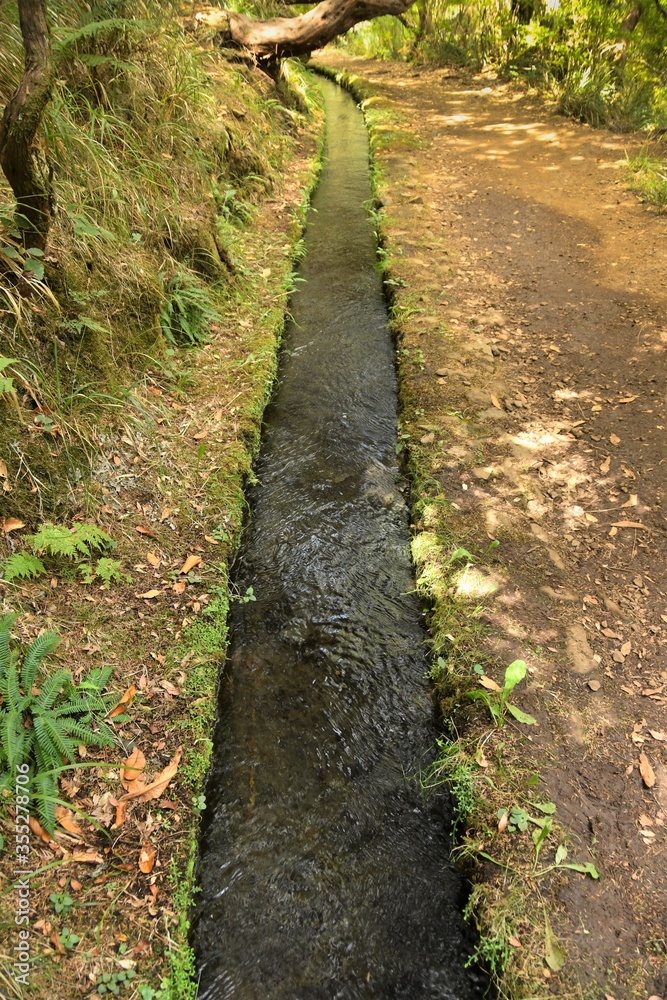 Water irrigation channel alongside one of the many hiking trails which ...