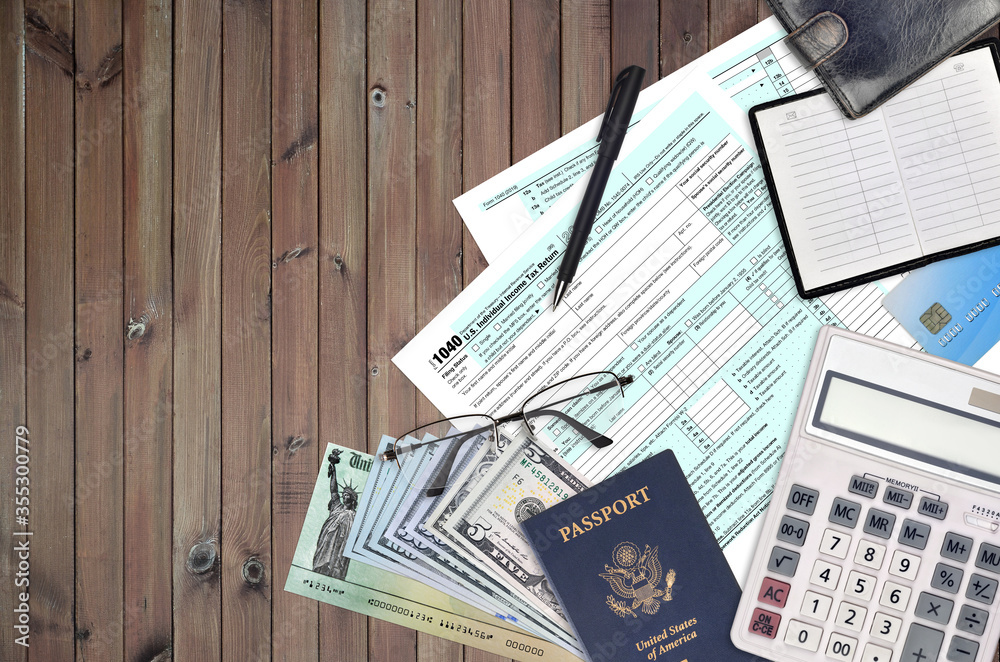 IRS form 1040 U.S. Individual income tax return with refund check lies ...