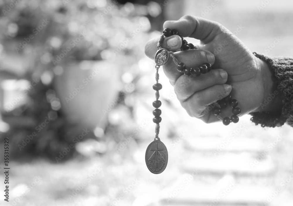 The Divine Mercy devotion concept with a prayer hand holding The Divine ...