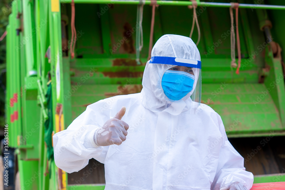 Garbage men like and thumb and up wear PPE protective clothing against ...