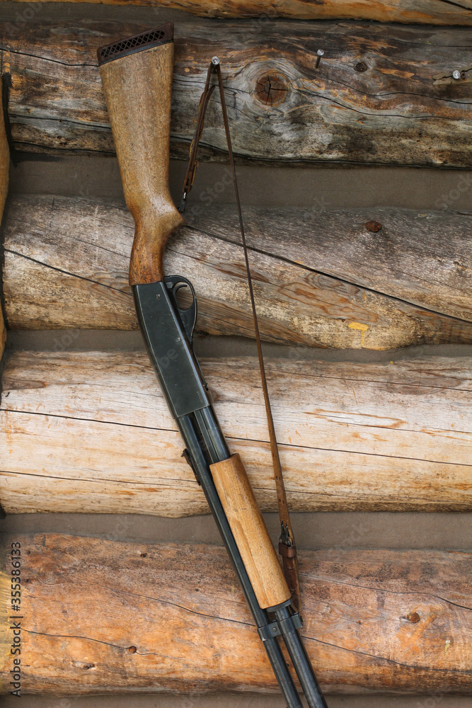 Yukon Territory, Alaska. Shotgun hanged at the door of a cabin for ...