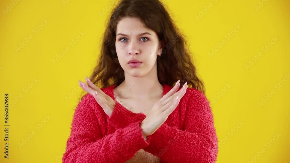 Angry and frustrated woman shows her crossed arms in x gesture sign and ...