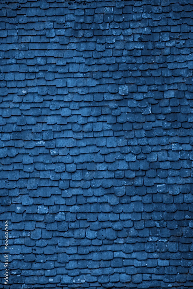 Vintage ceramic clay tiles roof texture background in deep classic blue ...