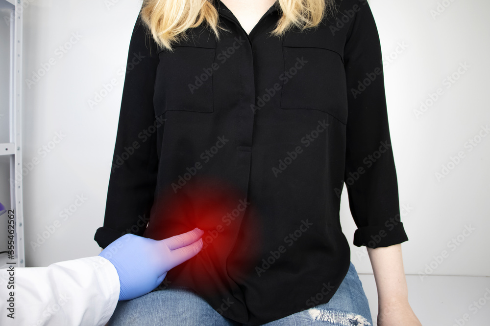 A woman suffers from pain in the appendix. Acute appendicitis, Crohn's ...