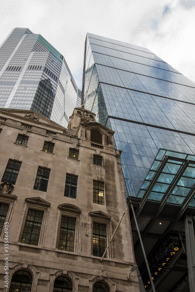 Evolving architecture. Old and modern design inner-city buildings ...