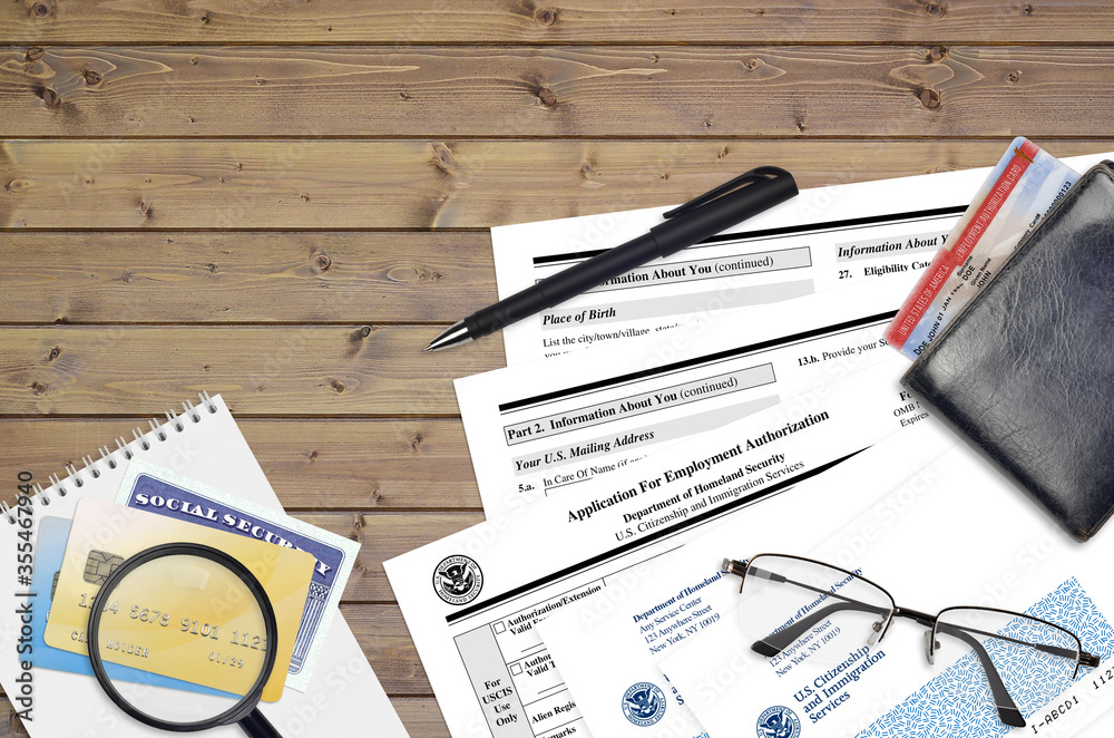USCIS form I-765 Application for employment authorization lies on flat ...