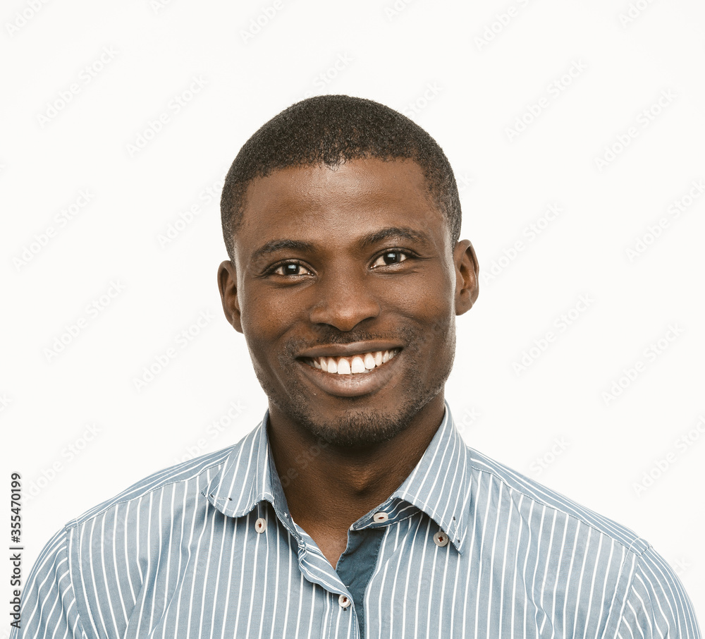 Toothy smiling African American man in shirt on white background ...