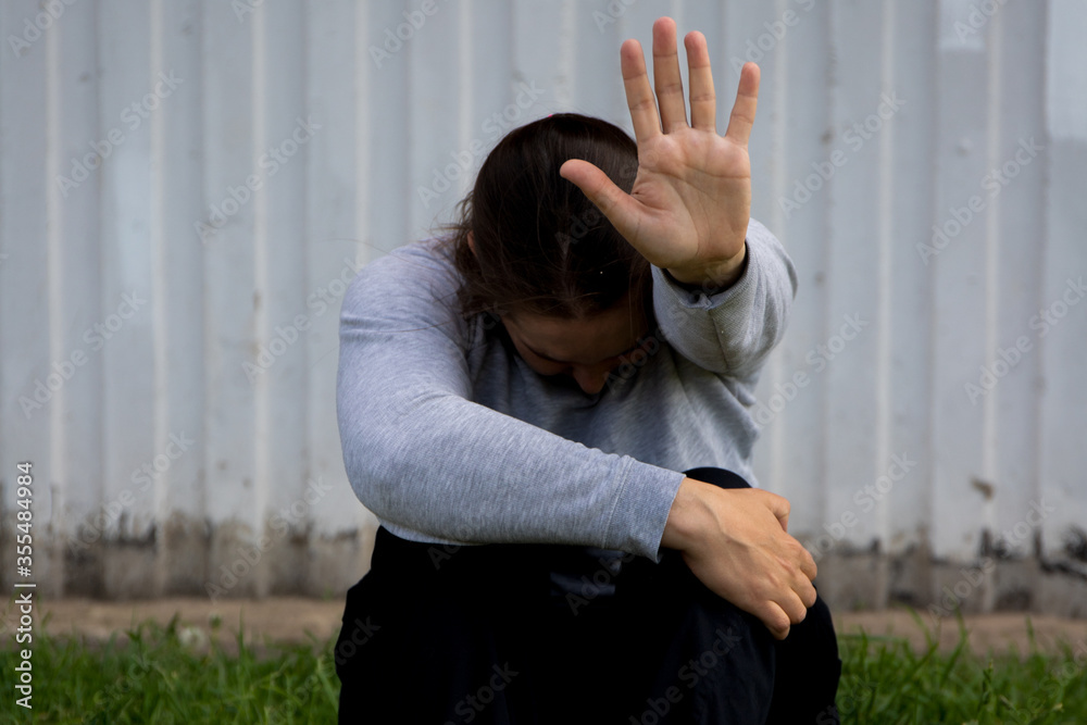 Oppressed woman shows by hand sign stop. Brutal treatment of women ...