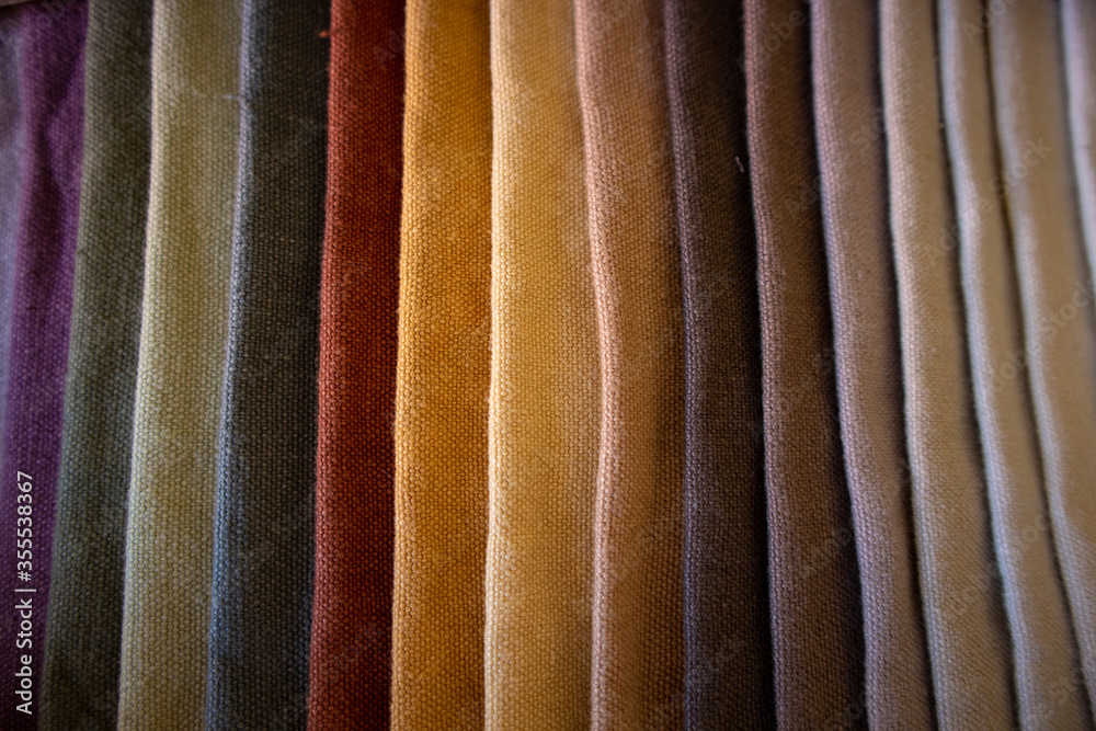 Rough fabric sample with color palette in various tones for showcasing ...