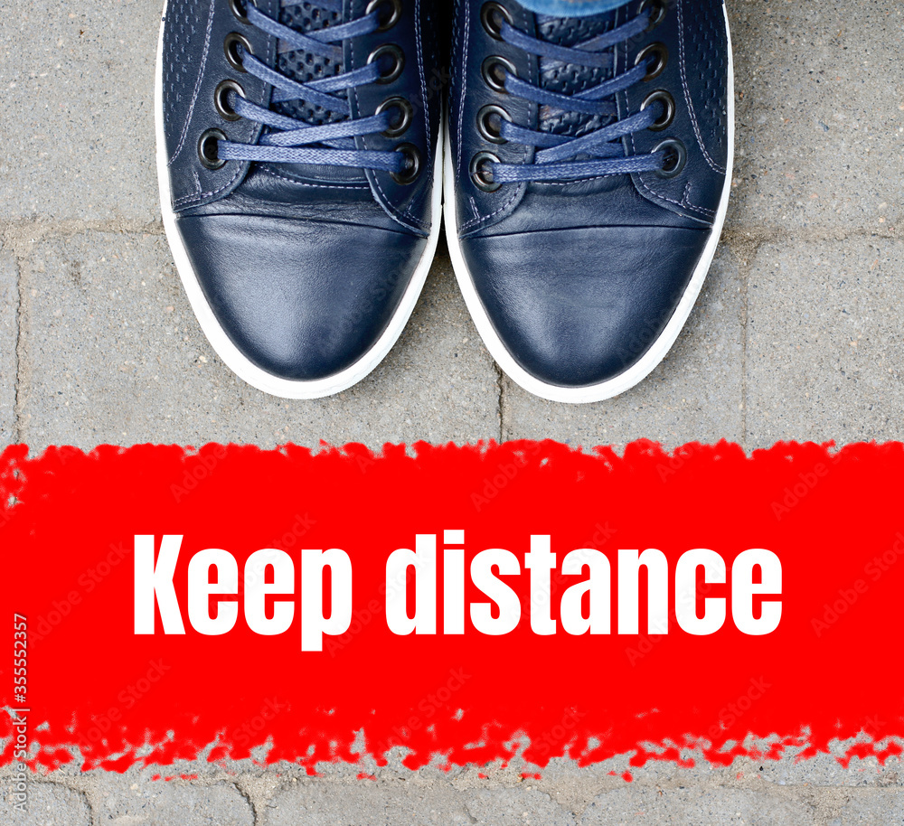 Top view on male navy blue sneakers standing on the pavement in front ...