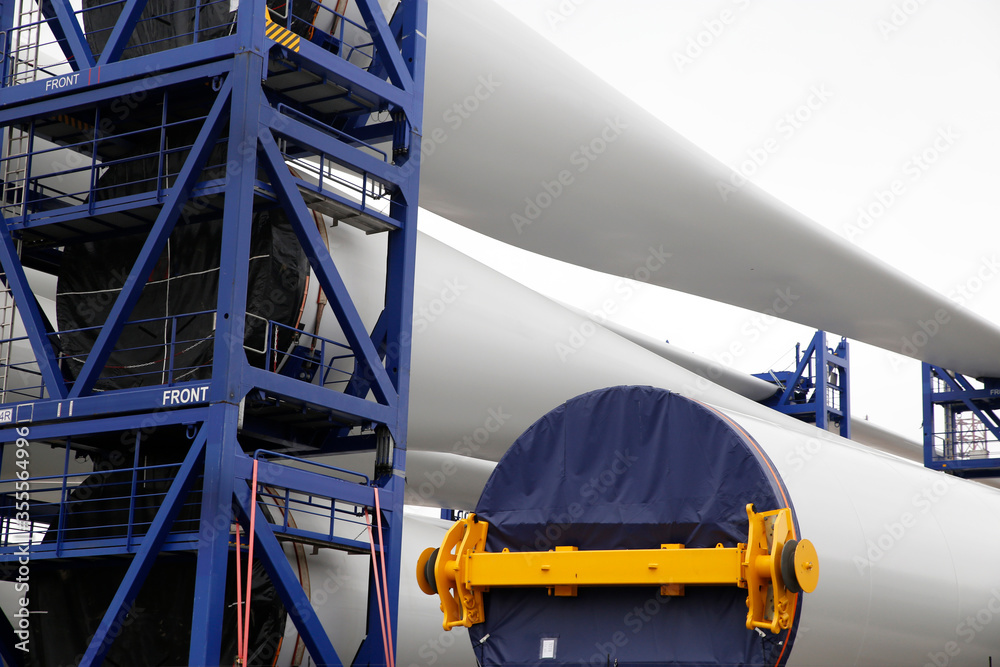 Newly constructed wings of wind-turbines ready to be transported to an ...