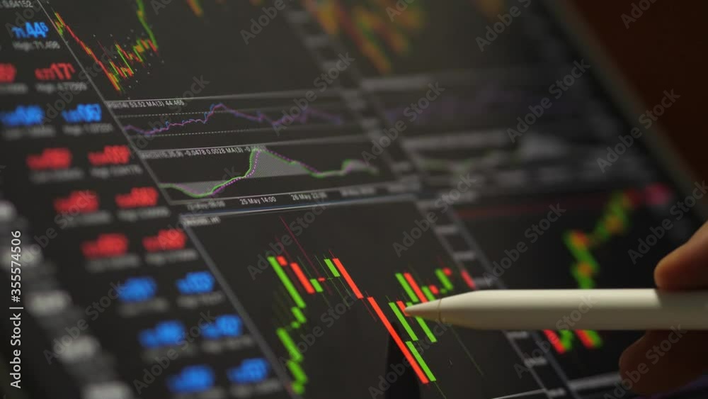trader use pen trade forex maket stock on mobile with candle stick ...