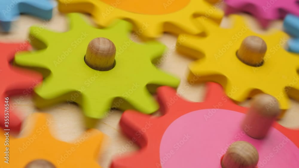 Working for common goal, conceptual. Gears and cogs in action. Side top ...