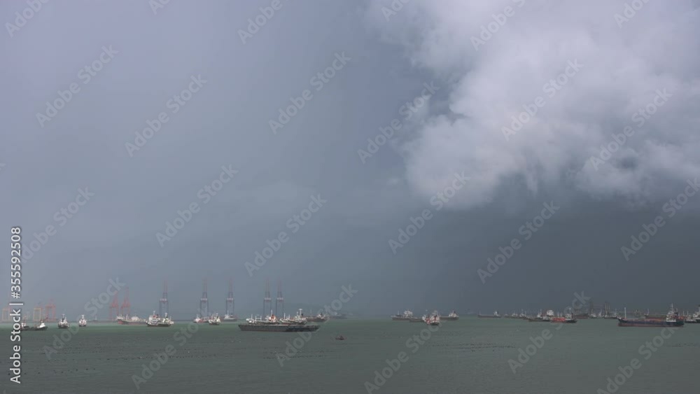Pan shot. Raining storm and tanker ship park in sea, Crude oil tanker ...