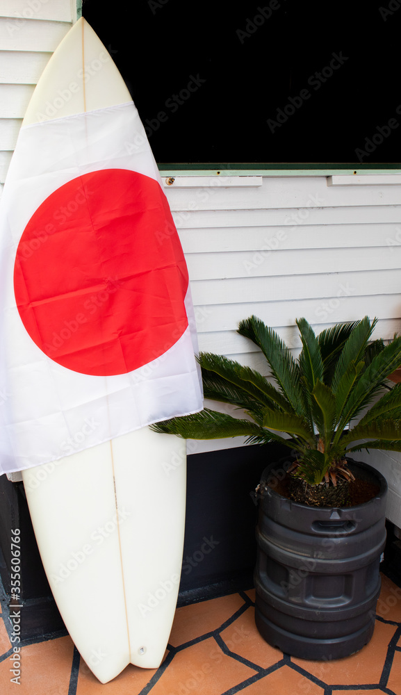 Japan Flag Surfboard, Surfing in Japan with a Japanese flag. Stock ...