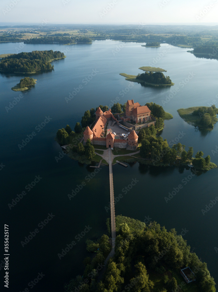 Aerial view of Medieval Trakai castle on green island in Galve lake ...