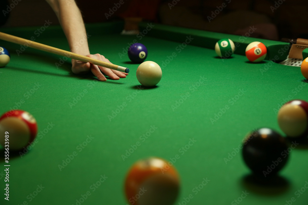 billiard background with color pool balls and cues on green table Stock ...