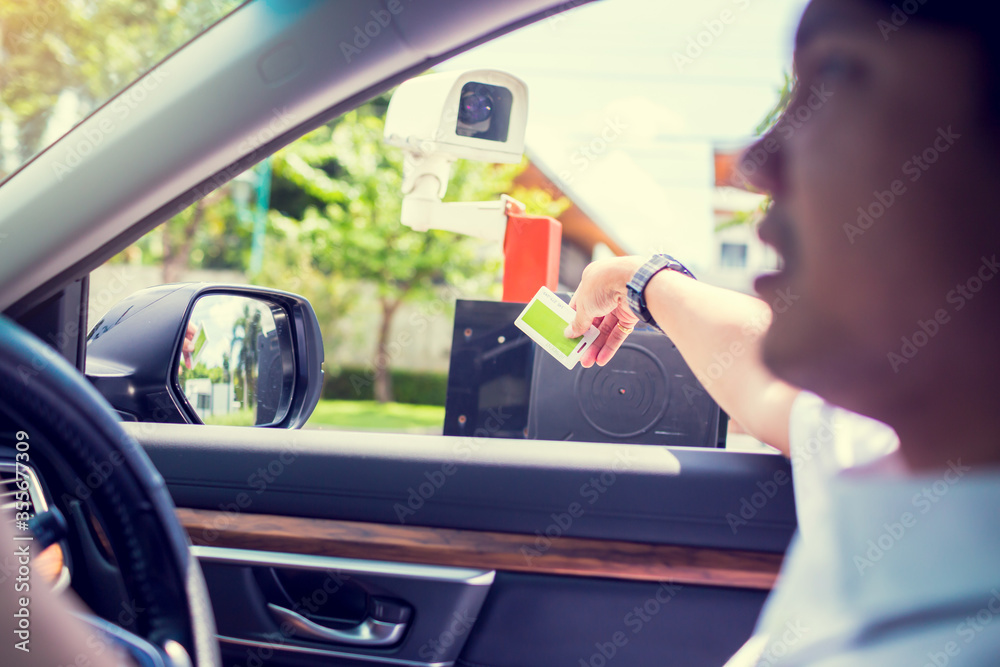 Man driver stop car and use key card to open the door for safety with ...
