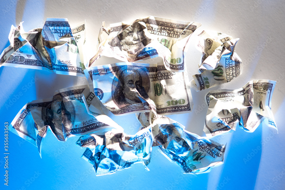 Crumpled money as a symbol of cash inconvenience. Concept - the ...