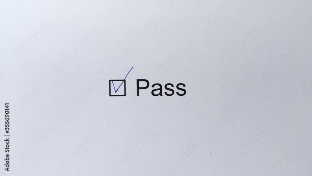 Checkbox PASS with a tick. Man hand draws check mark in the field with ...