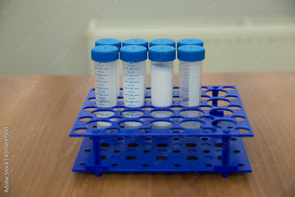 Close-up of new medical test tube . Rack with many falcone tubes ...
