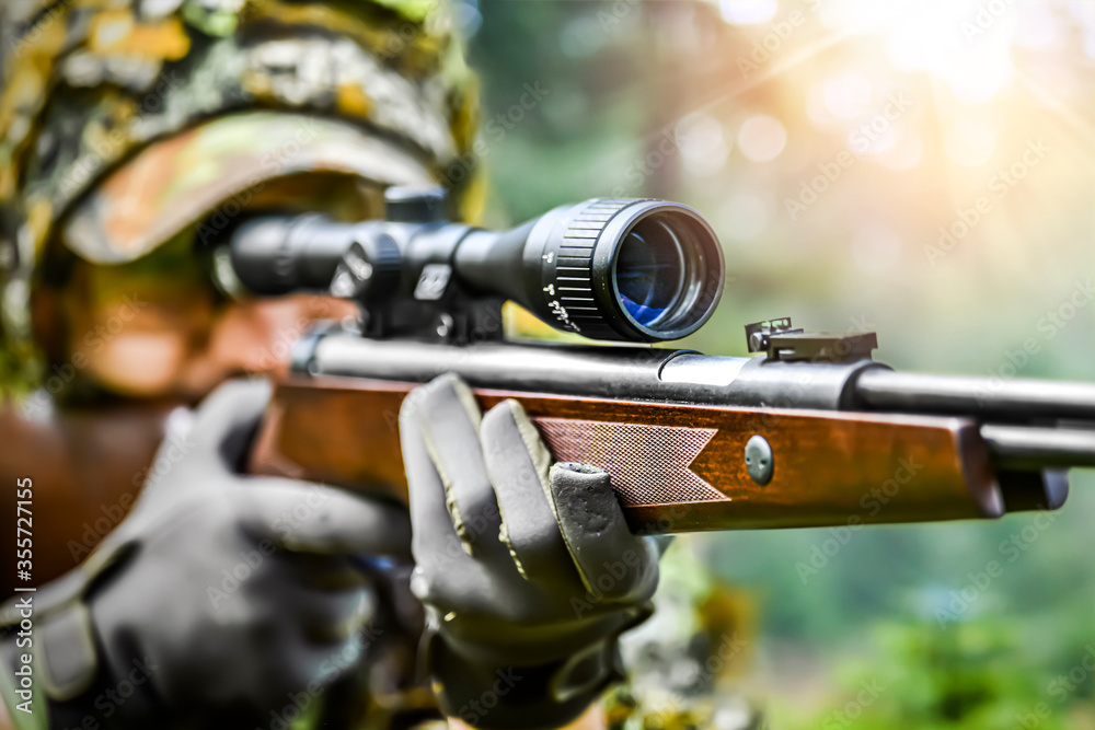 Shooter is on the hunting. Hunt prey rifle. Hunter man aiming on ...