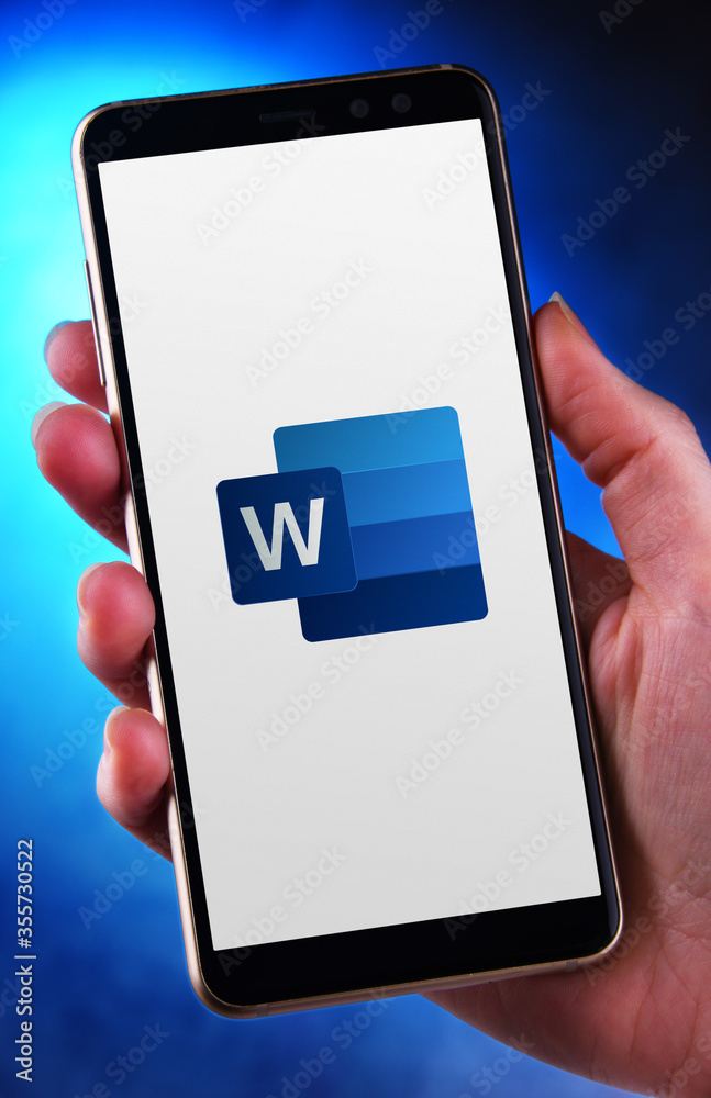 Hand holding smartphone displaying logo of Microsoft Word Stock Photo ...