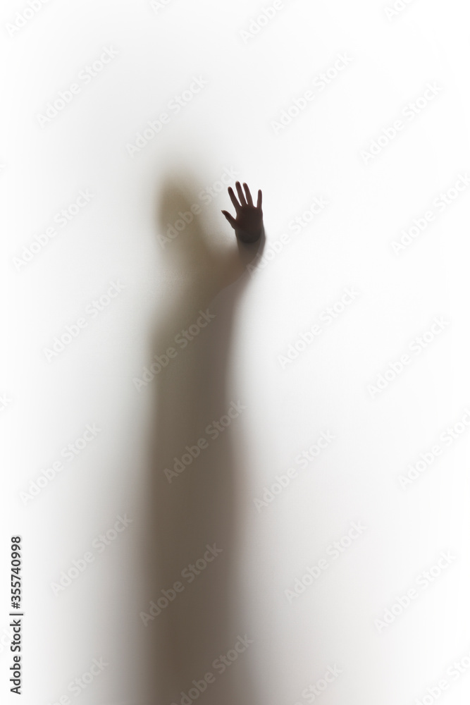 Diffuse silhouette of a human body, sharp hand and finger shadow. Stock ...
