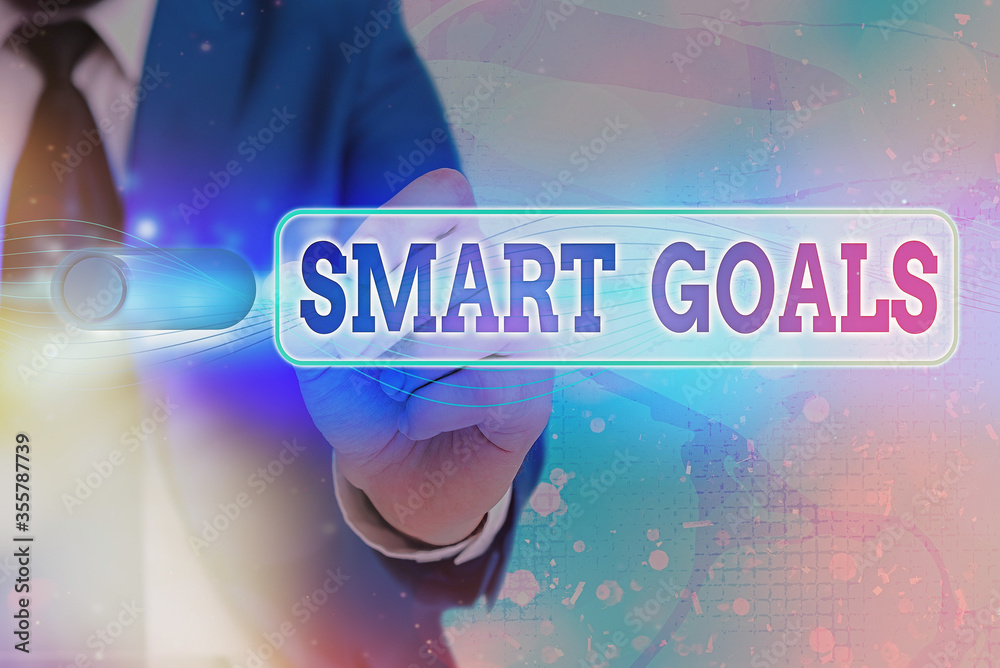 Writing note showing Smart Goals. Business concept for mnemonic used as ...