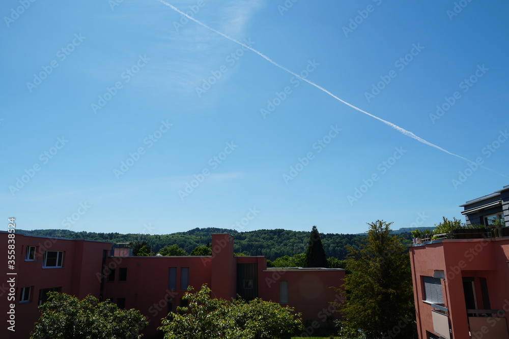 A white line crossing the sky showing trajectory of a plane. An unusual ...