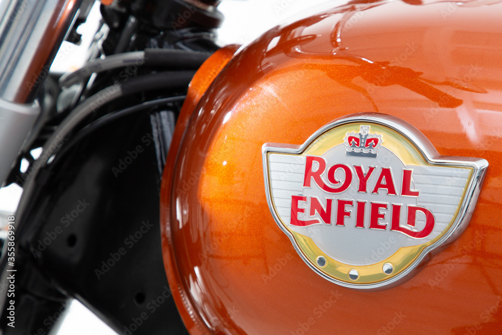 royal Enfield logo sign on motorcycle fuel tank orange color of vintage ...
