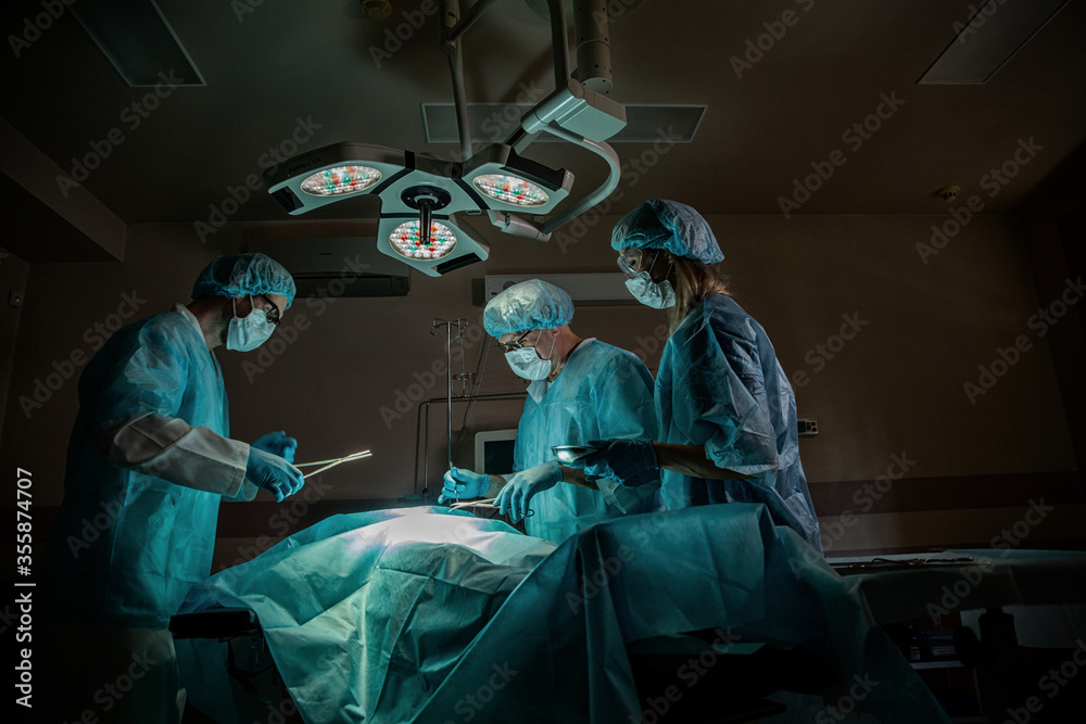 Team of Professional Surgeons and Nurses Suture Wound after Successful ...