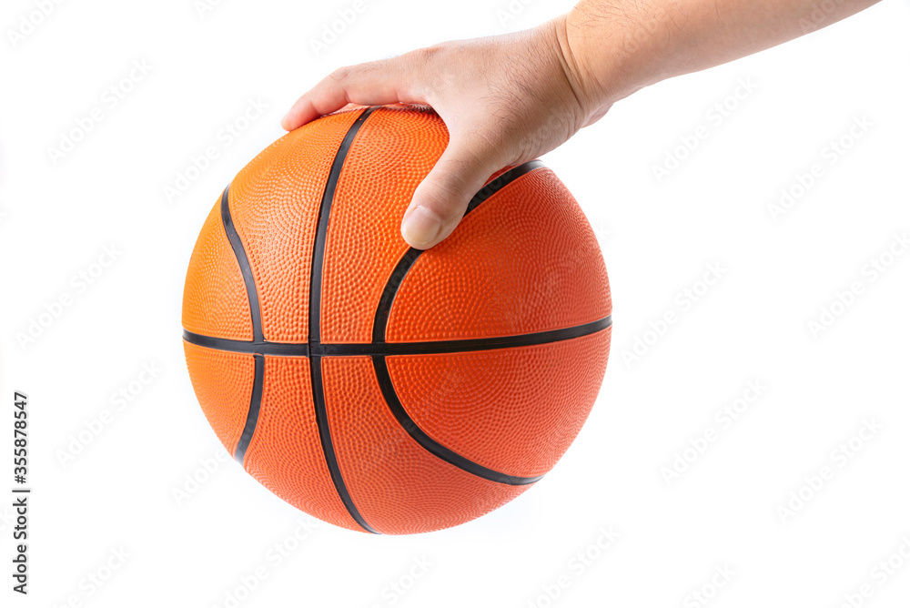 Asian man's hand is holding or palming an orange basketball in hand ...