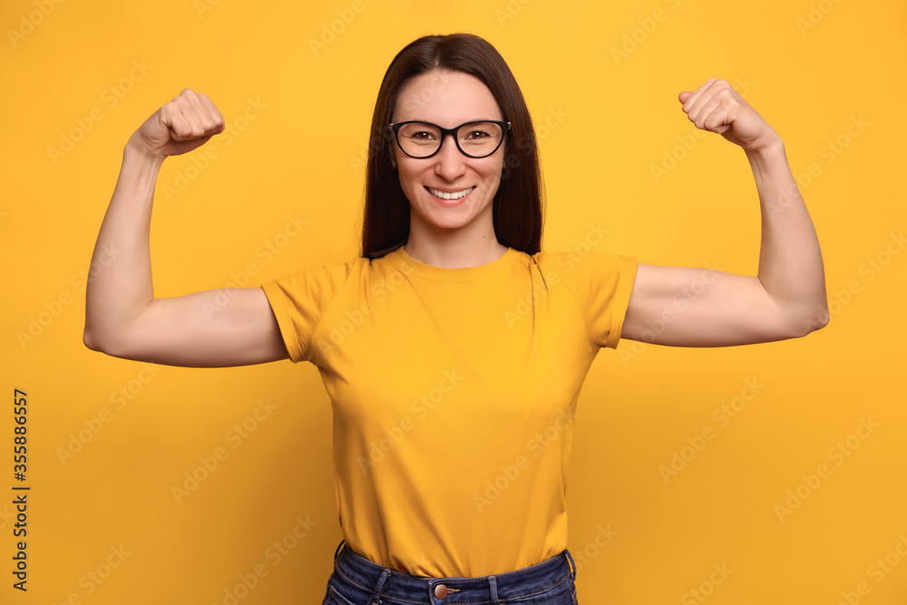 Strong powerful woman with dark hair, eyeglasses and toothy smile ...