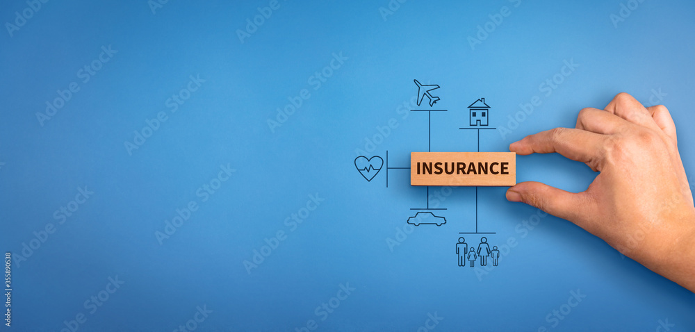 hand holding a wooden block with text insurance, different type of ...