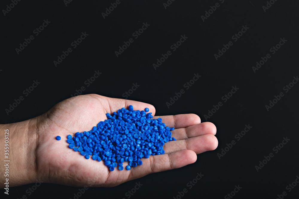 Blue plastic grain, plastic polymer granules,hand hold Polymer pellets ...