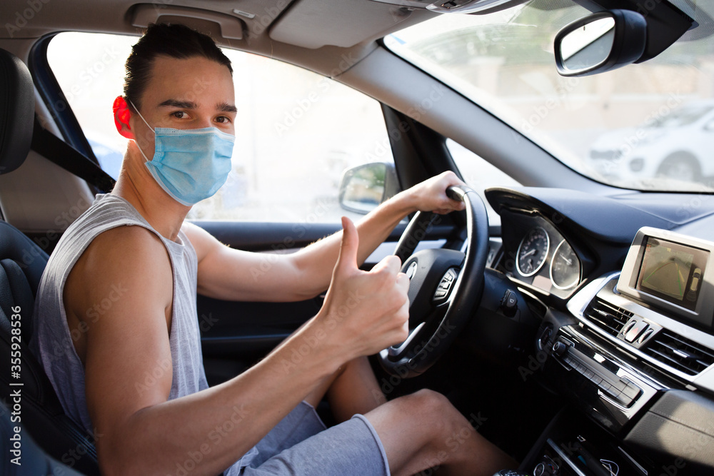 Thumbs up! Young male driver giving approval hand gesture to the camera ...