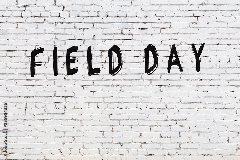 Word field day painted on white brick wall Stock Illustration | Adobe Stock