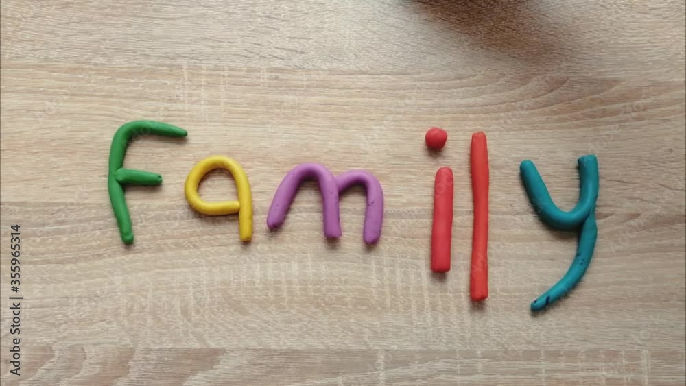 Concept of happy family. Hands spread in colored letters word Family of ...