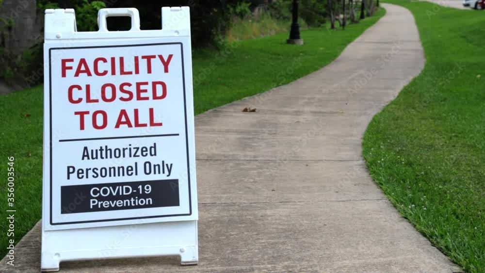Tilt up to reveal sign for Facility Closed due to COVID-19 Prevention ...