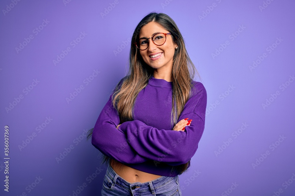 Young beautiful smart woman wearing glasses over purple isolated ...
