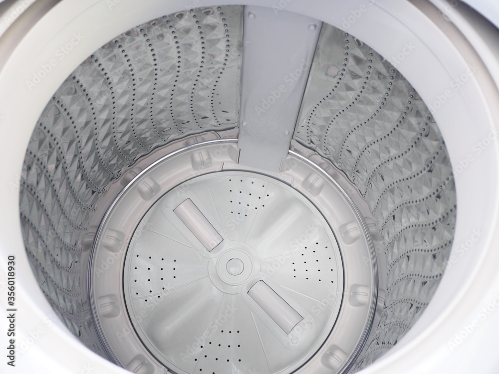 white washing machine without clothes loaded inside. Stock Photo ...