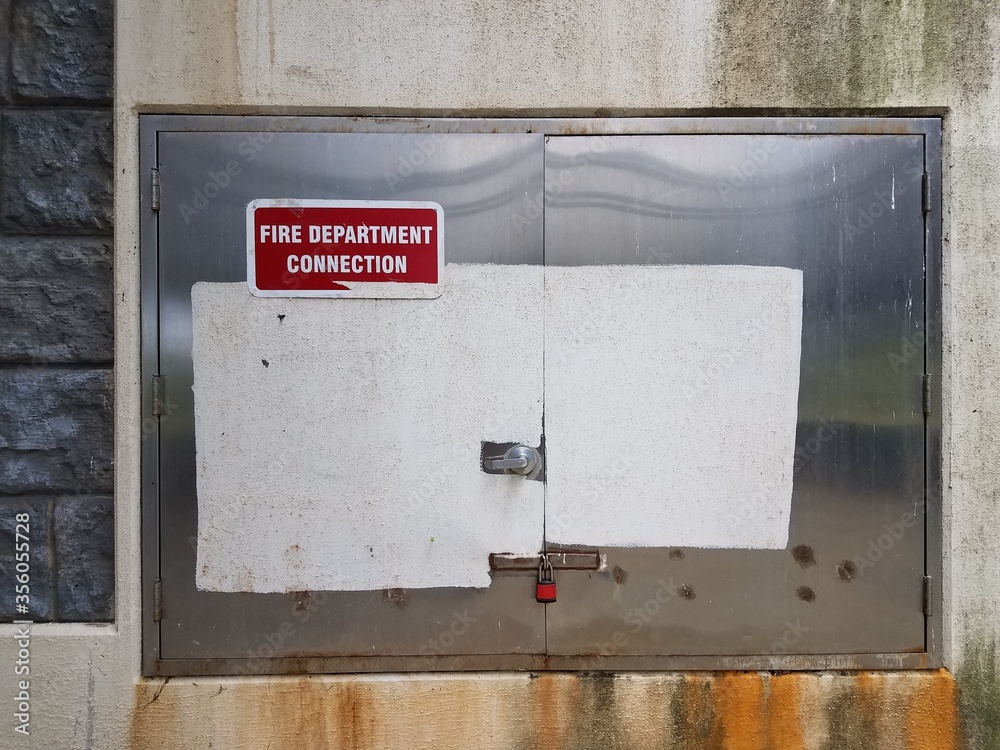 fire department connection sign and metal door Stock Photo | Adobe Stock