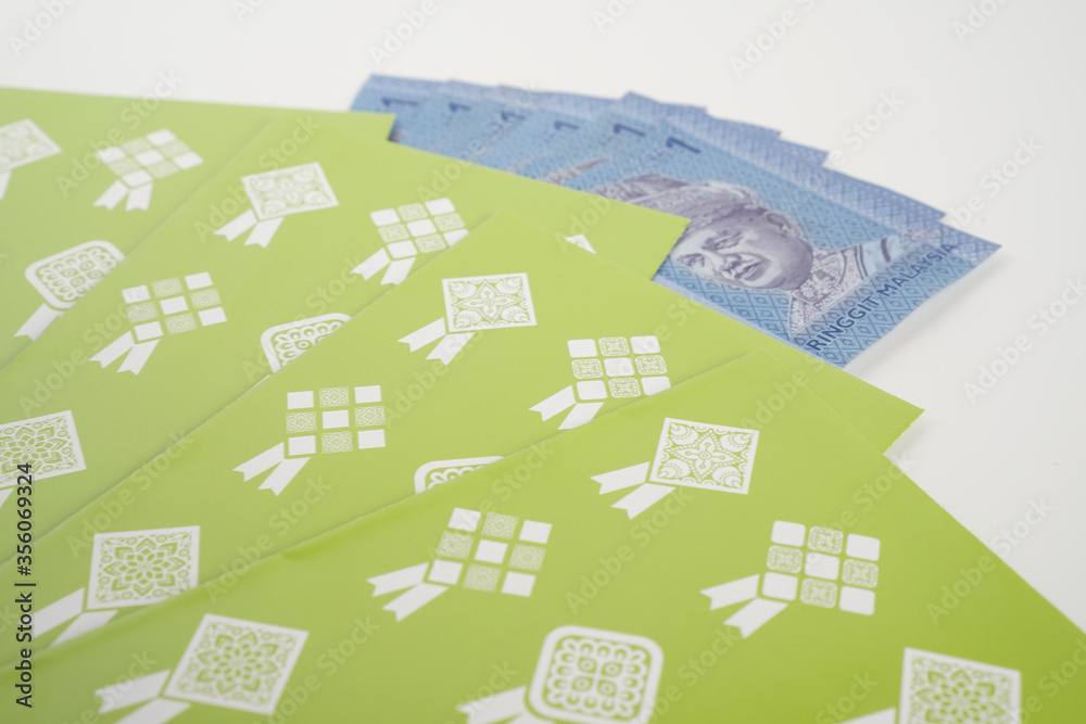 'Duit Raya' is money given from adult to children during Eid al-Fitr ...