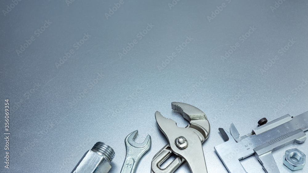 different renovation instruments and working tools on grey metallic ...