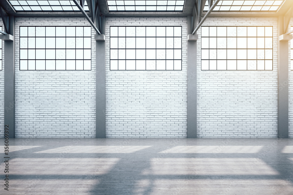 Modern warehouse interior with window and blank brick wall. Stock Photo ...