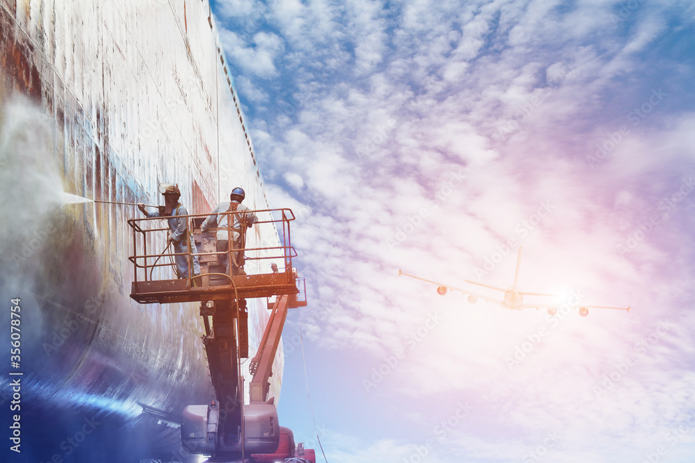 Washing and Cleaning in shipyard, Worker in dry dock with water jet ...